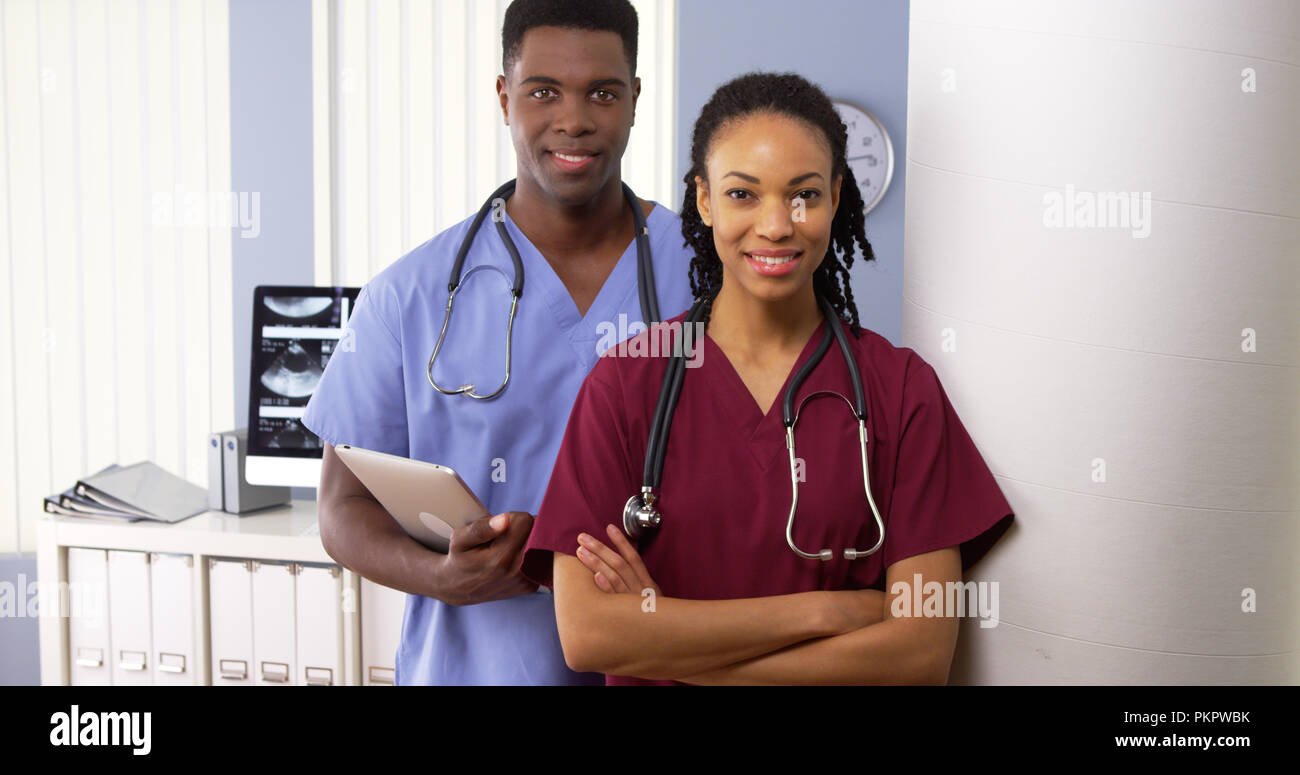 Team of African American medical doctors standing together in hospital ...