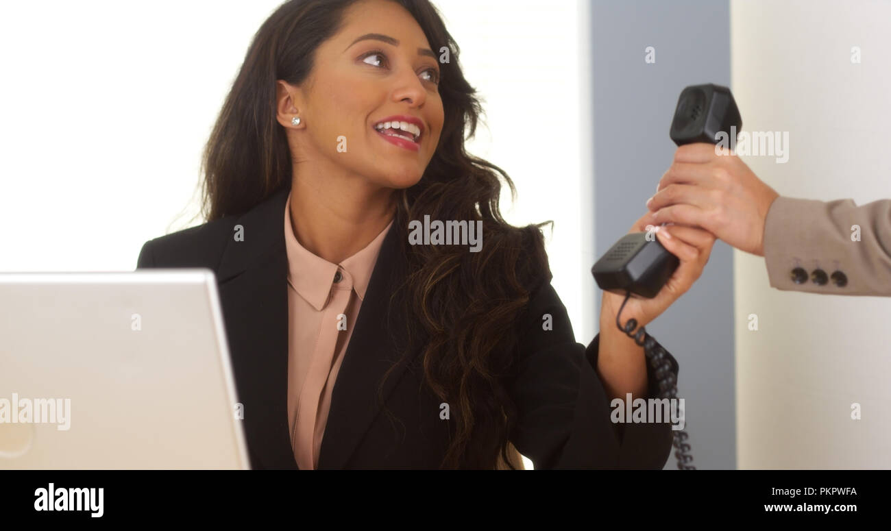 Mexican businesswoman answering phone call Stock Photo - Alamy