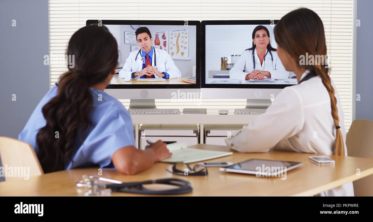 Team of diverse medical doctors having a video conference Stock Photo ...