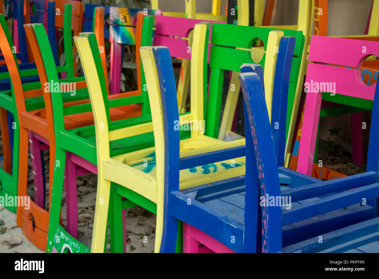 colorful chairs gathered at the end of summer Stock Photo - Alamy