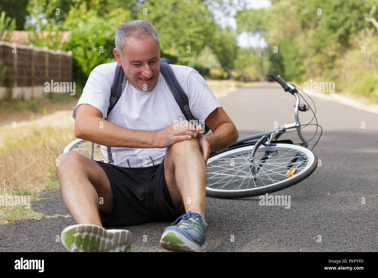 man having injuries after a fall on the bike Stock Photo - Alamy