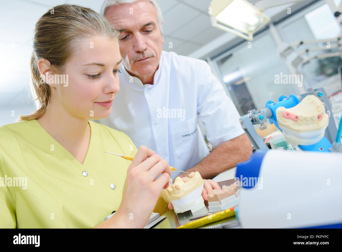 dental technician and supervisor working with tooth dentures Stock ...
