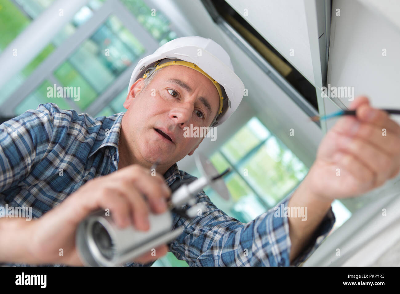 Installing security camera hi-res stock photography and images - Alamy
