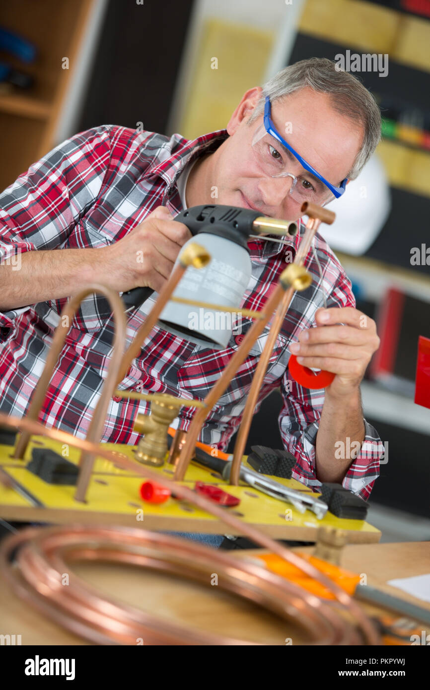 worker using a blowtorch Stock Photo - Alamy