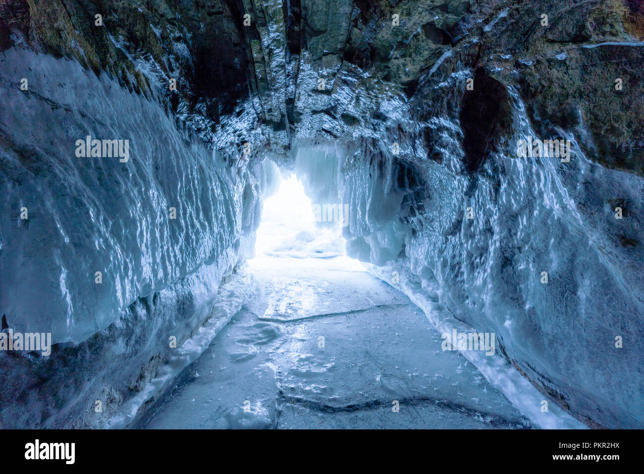Winter frozen ice cave at frozen lake Baikal in Siberia, Russia Stock ...