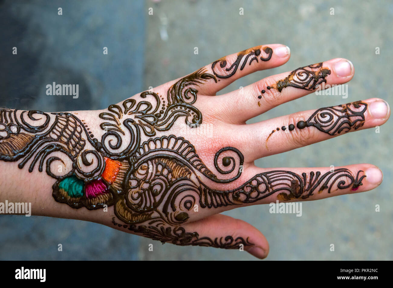 henna painted hand decorations - Hand recently painted with Henna Stock ...