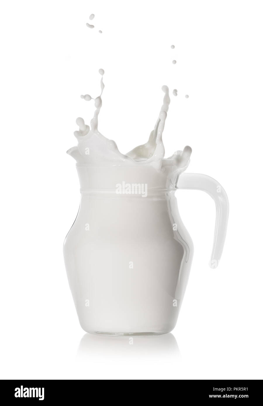 Splash in glass jar filled with milk isolated on white background Stock ...