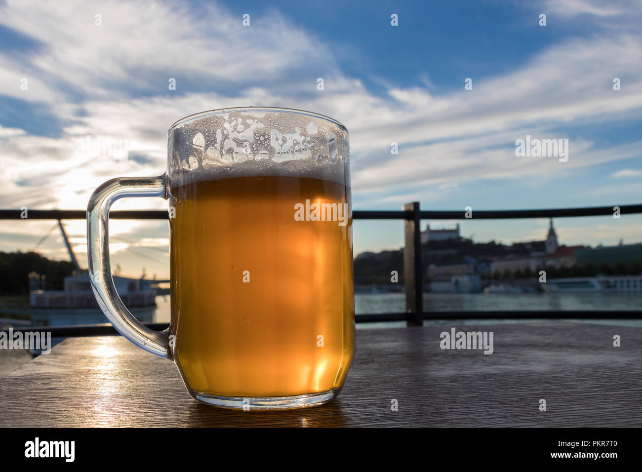 Close-up of one cold beer mug with foam and water drops on the ...