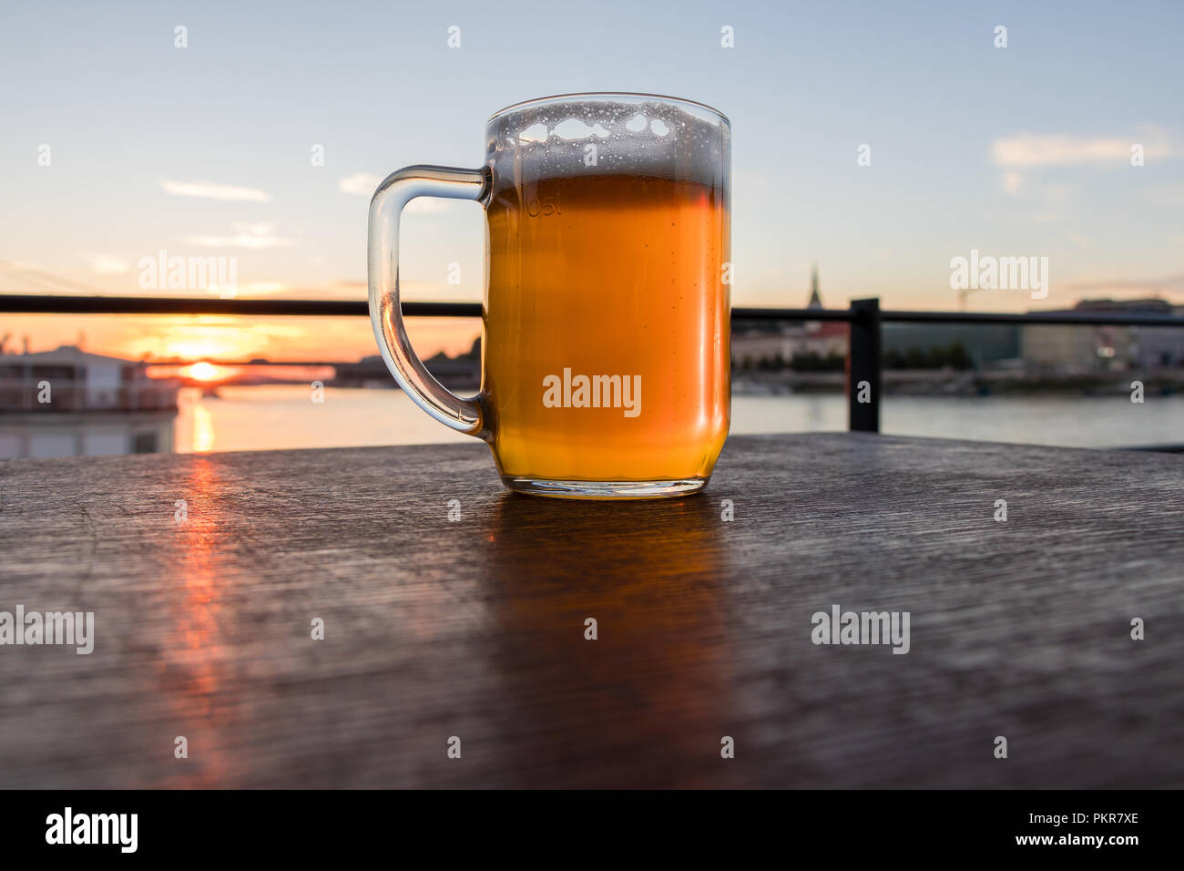 Sunset and lovely beer Stock Photo - Alamy