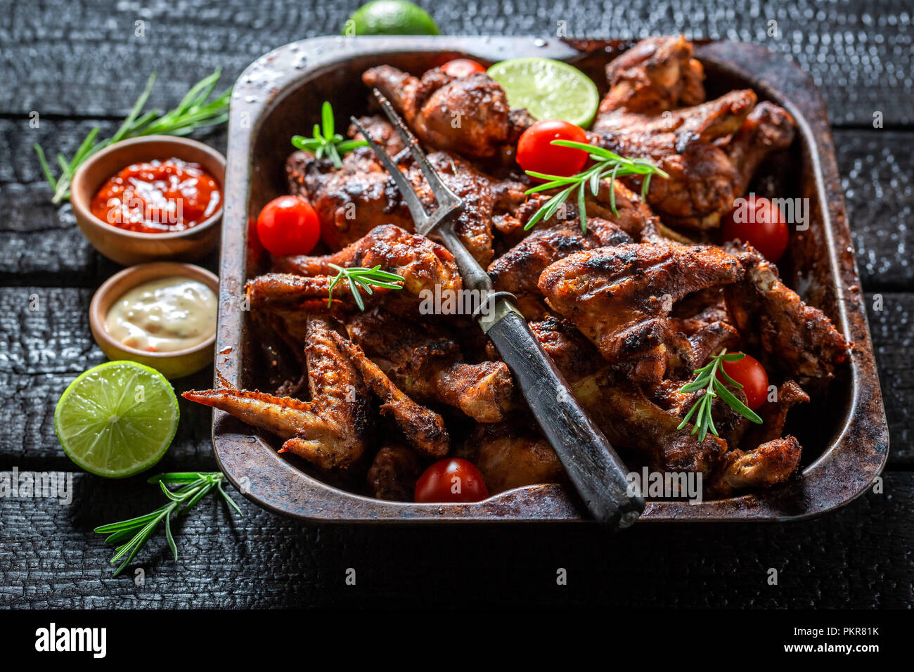 Crispy grilled chicken leg with rosemary and spices Stock Photo - Alamy