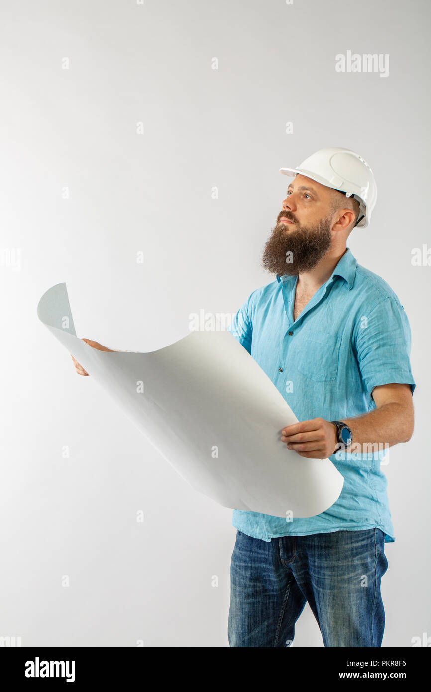 roll paper man reflective vest helmet. foreman or architect considers ...