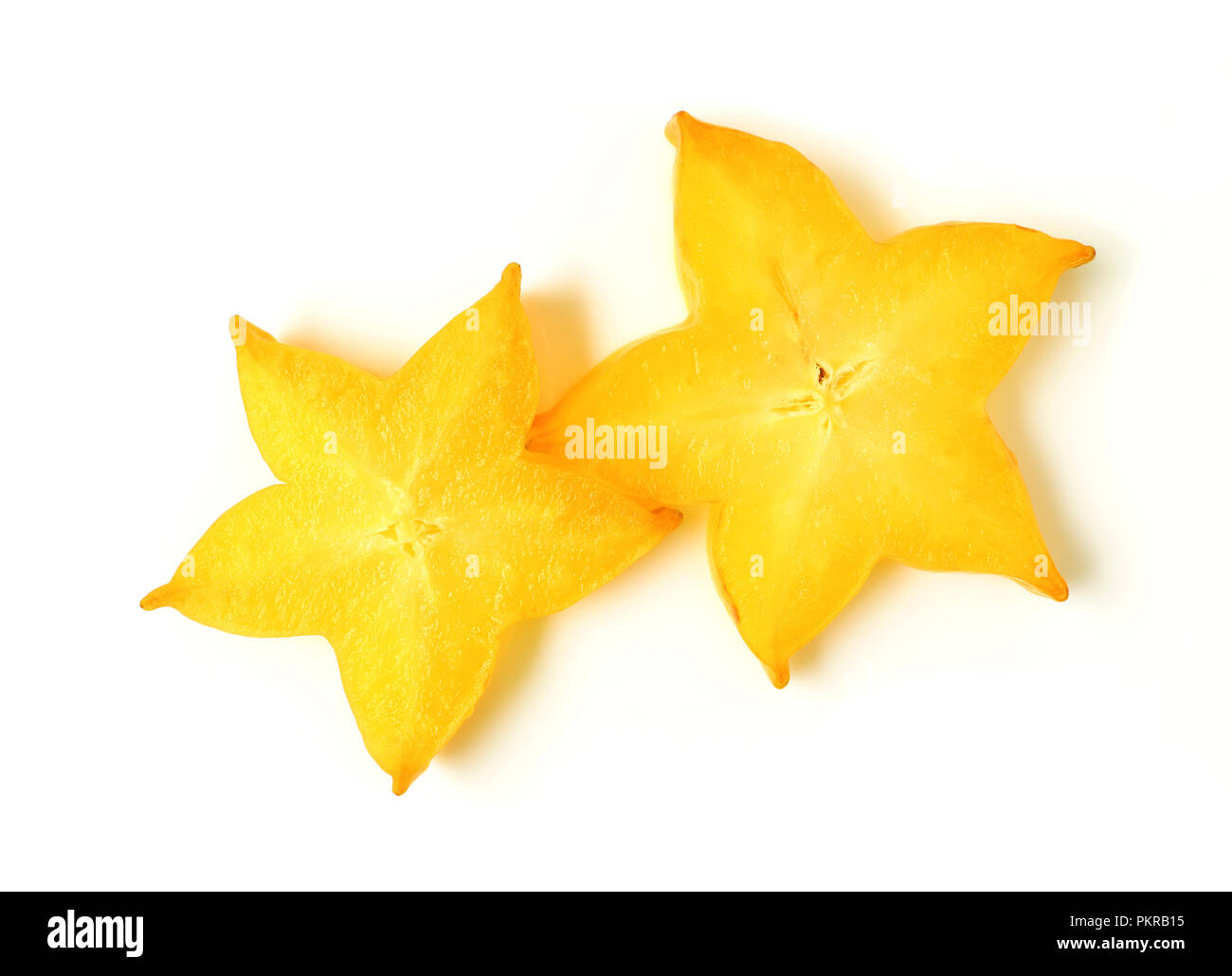 Top View of Vibrant Yellow Star Shape of Two Sliced Ripe Star Fruits on ...