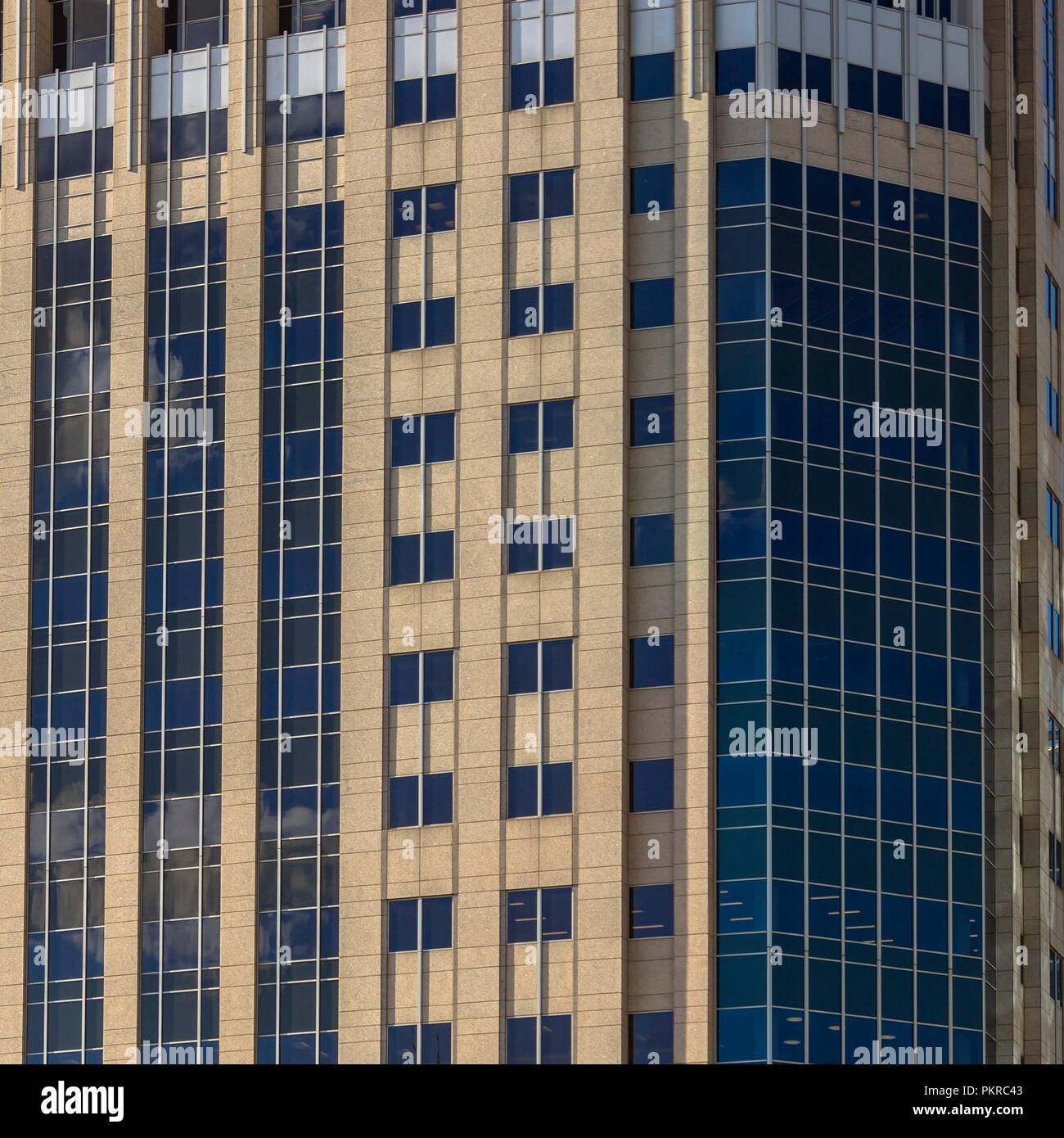 Facade of a building with blue glass windows Stock Photo - Alamy