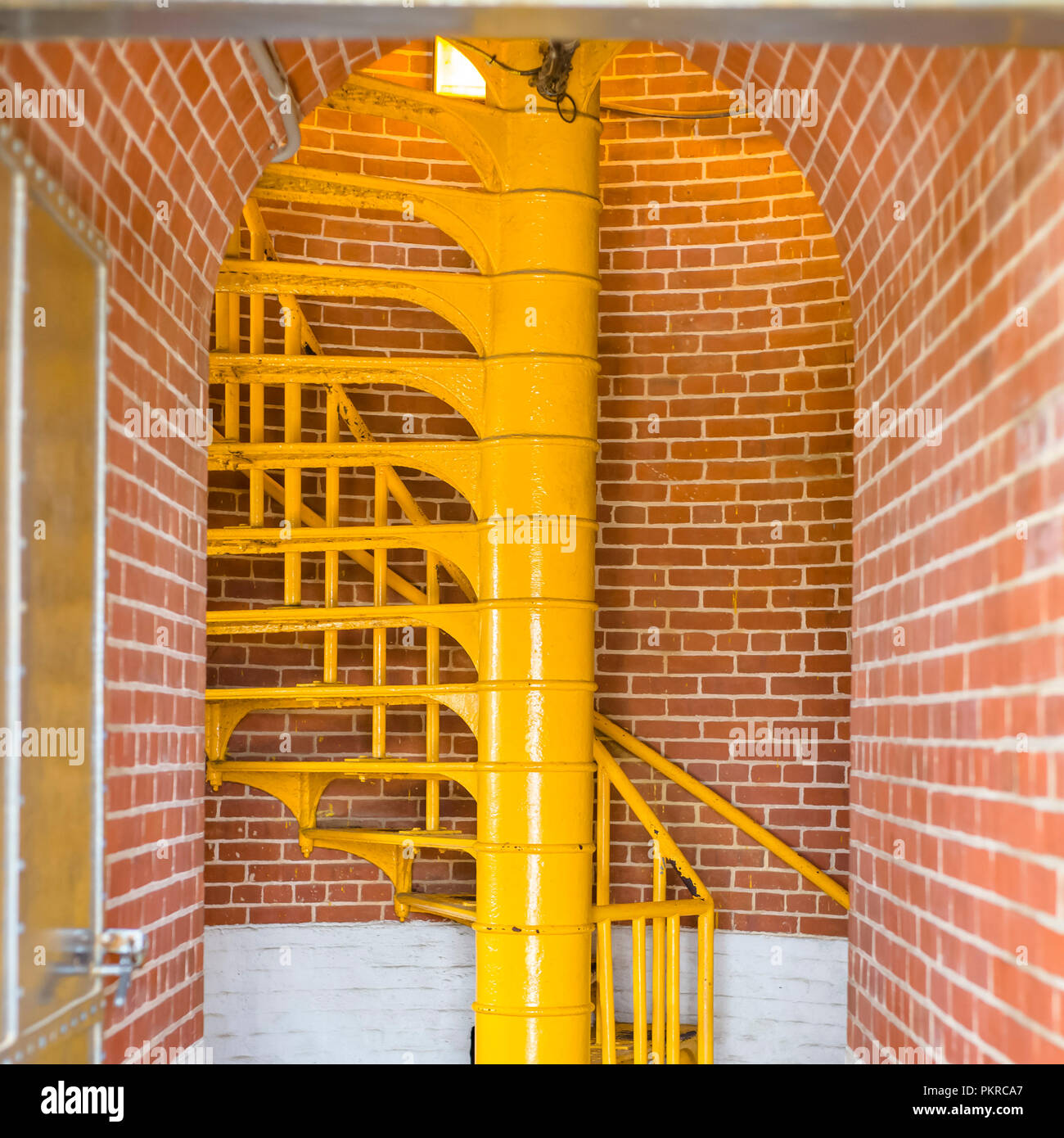 Yellow stairs and arched entry way of lighthouse Stock Photo - Alamy