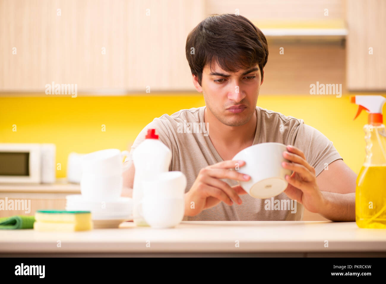 Man washing dishes at home Stock Photo - Alamy