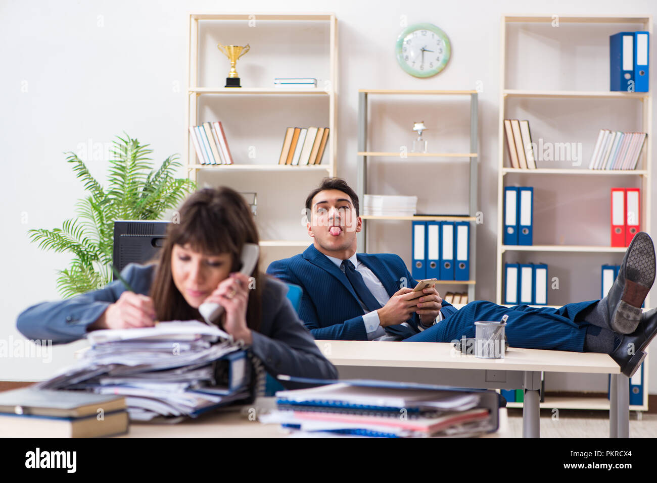 Male and female employees in office Stock Photo - Alamy
