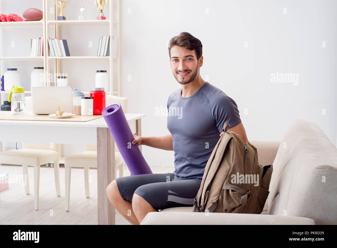 Young man getting ready for gym sports Stock Photo - Alamy