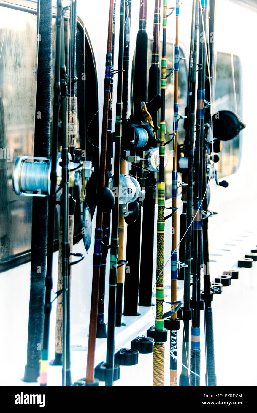 A row of rod and reels on a fishing boat Stock Photo - Alamy