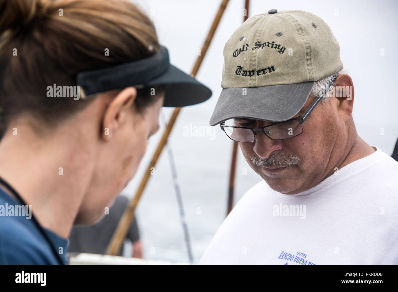 Two middle aged adults talking about something serious Stock Photo - Alamy