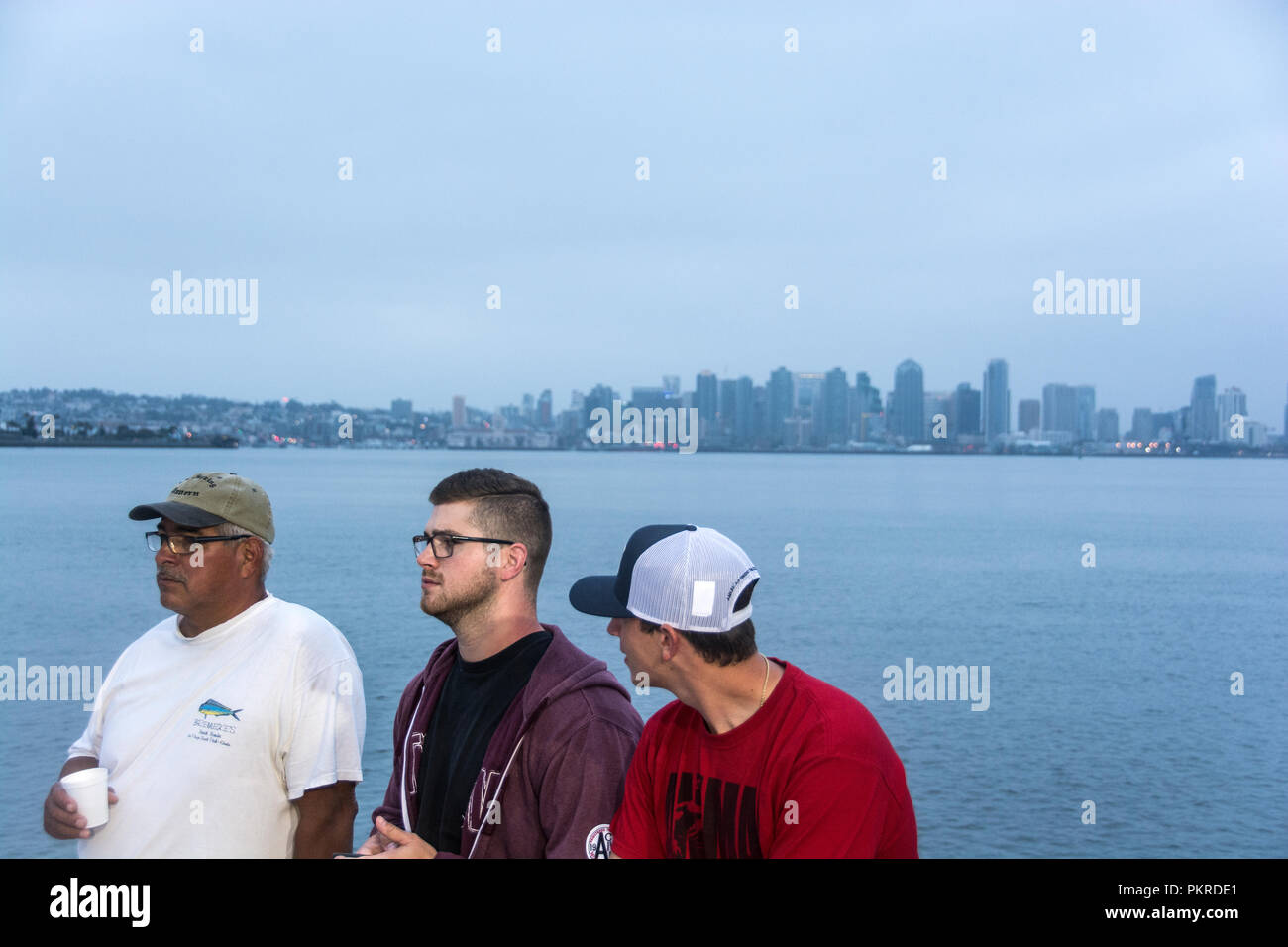 Three fishermen talking hi-res stock photography and images - Alamy