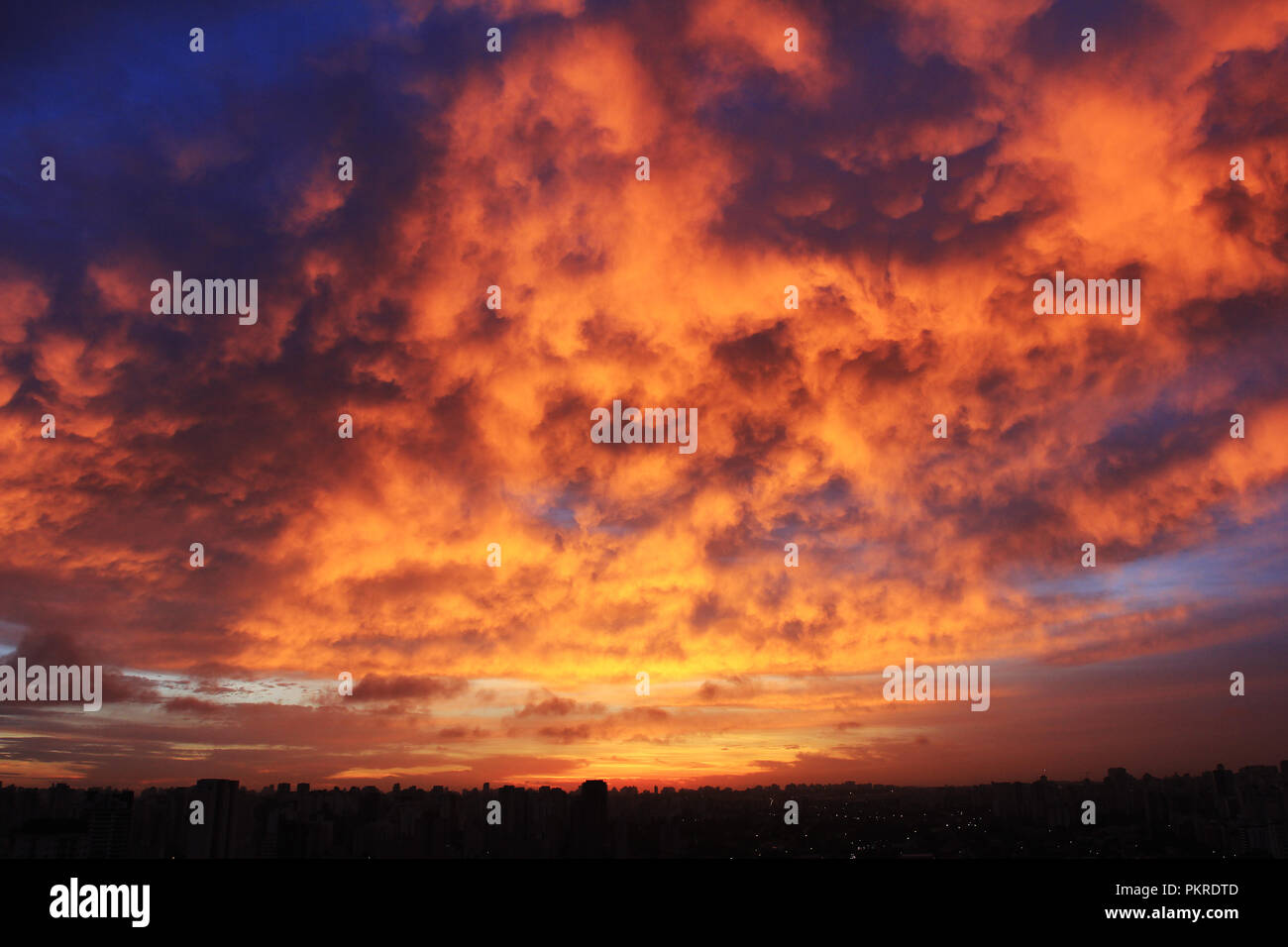 Clouds in sunset with fire color. Dramatic sunset like fire in the sky ...