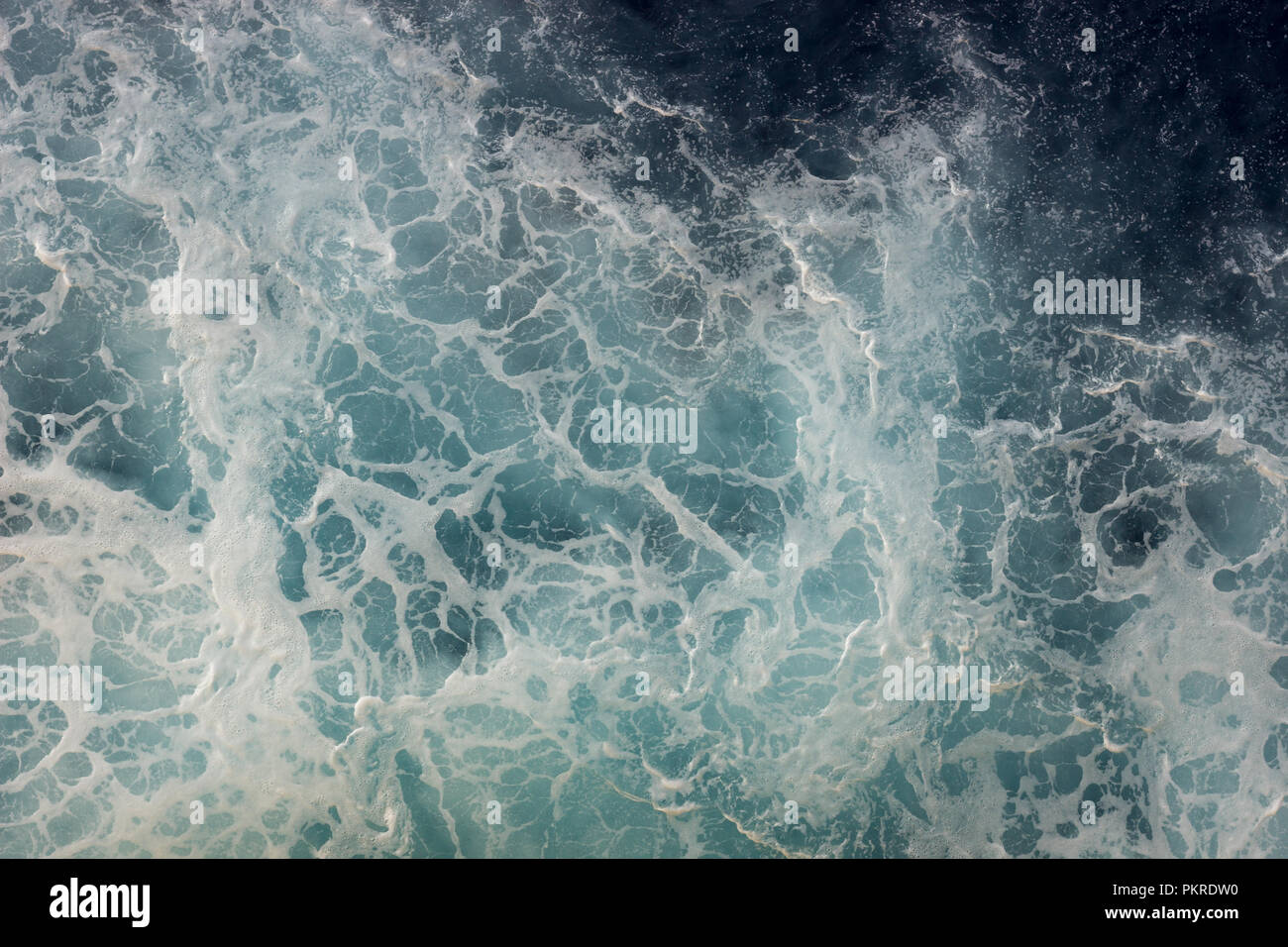 Foam on the deep sea waters seen from above Stock Photo - Alamy