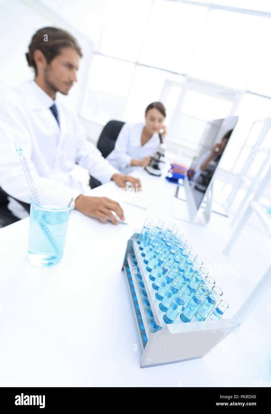 side view of scientists working in laboratory Stock Photo - Alamy