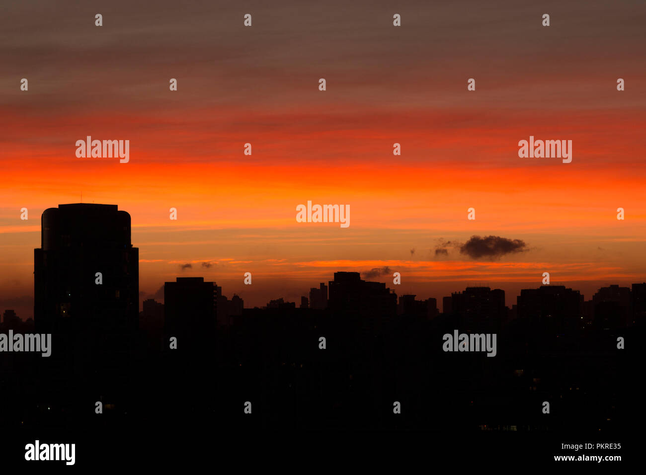 Sunrise between buildings Stock Photo - Alamy