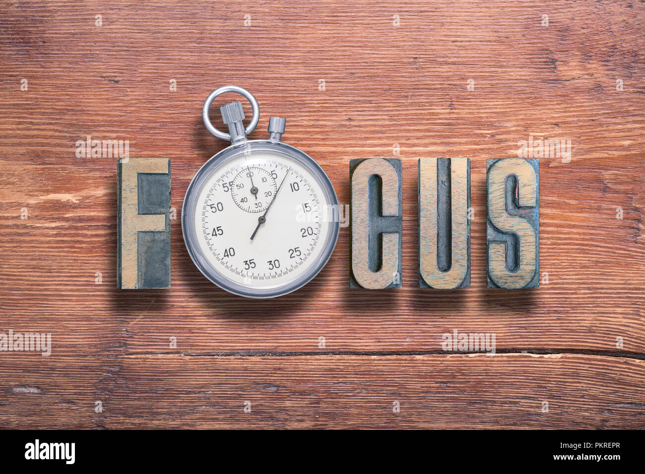 focus word combined on vintage varnished wooden surface with stopwatch ...