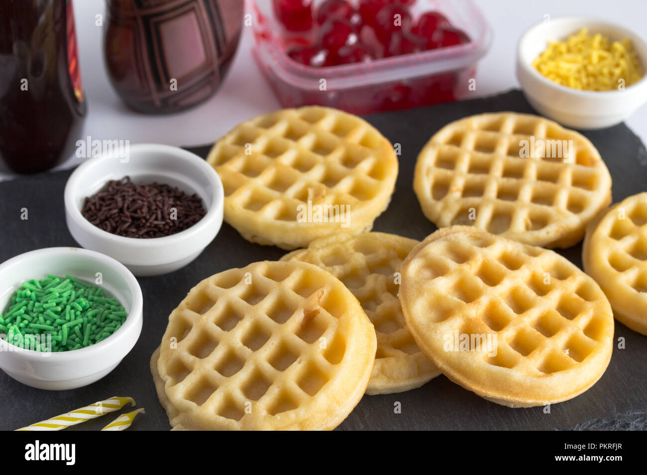 Waffles with sprinkles, sweet decorating accessories and birthday ...