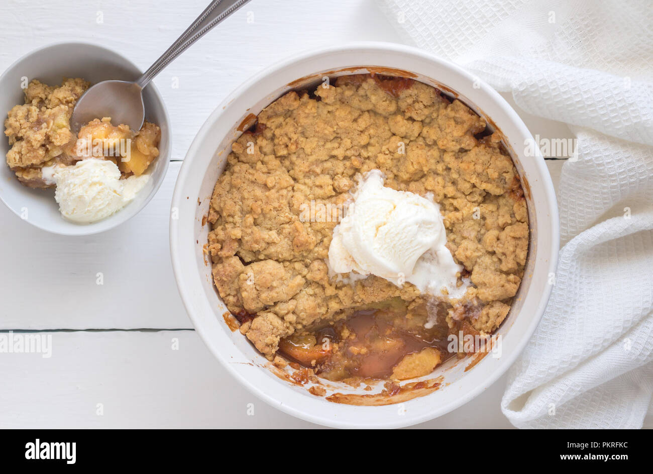 Apple crumble dessert with vanilla icecream on white background - Top ...