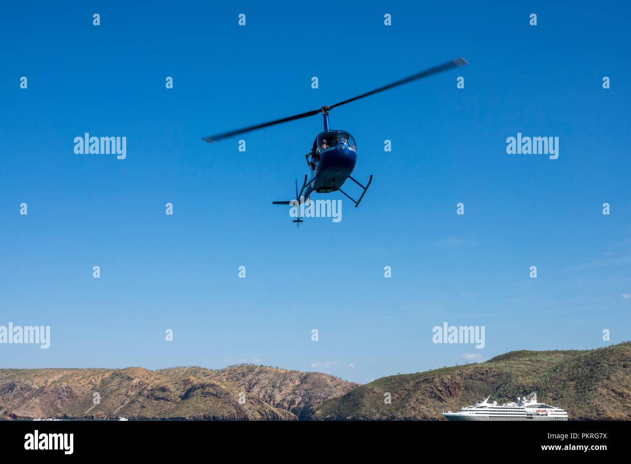Helicopter coming in to land on pontoon in Talbot Bay from a scenic ...