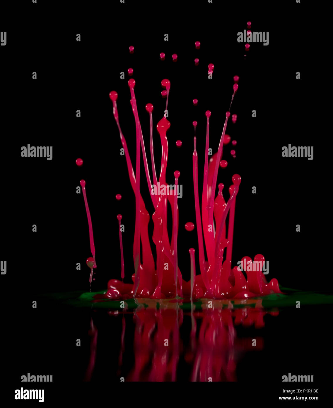 Red paint, ink splash on black background Stock Photo - Alamy
