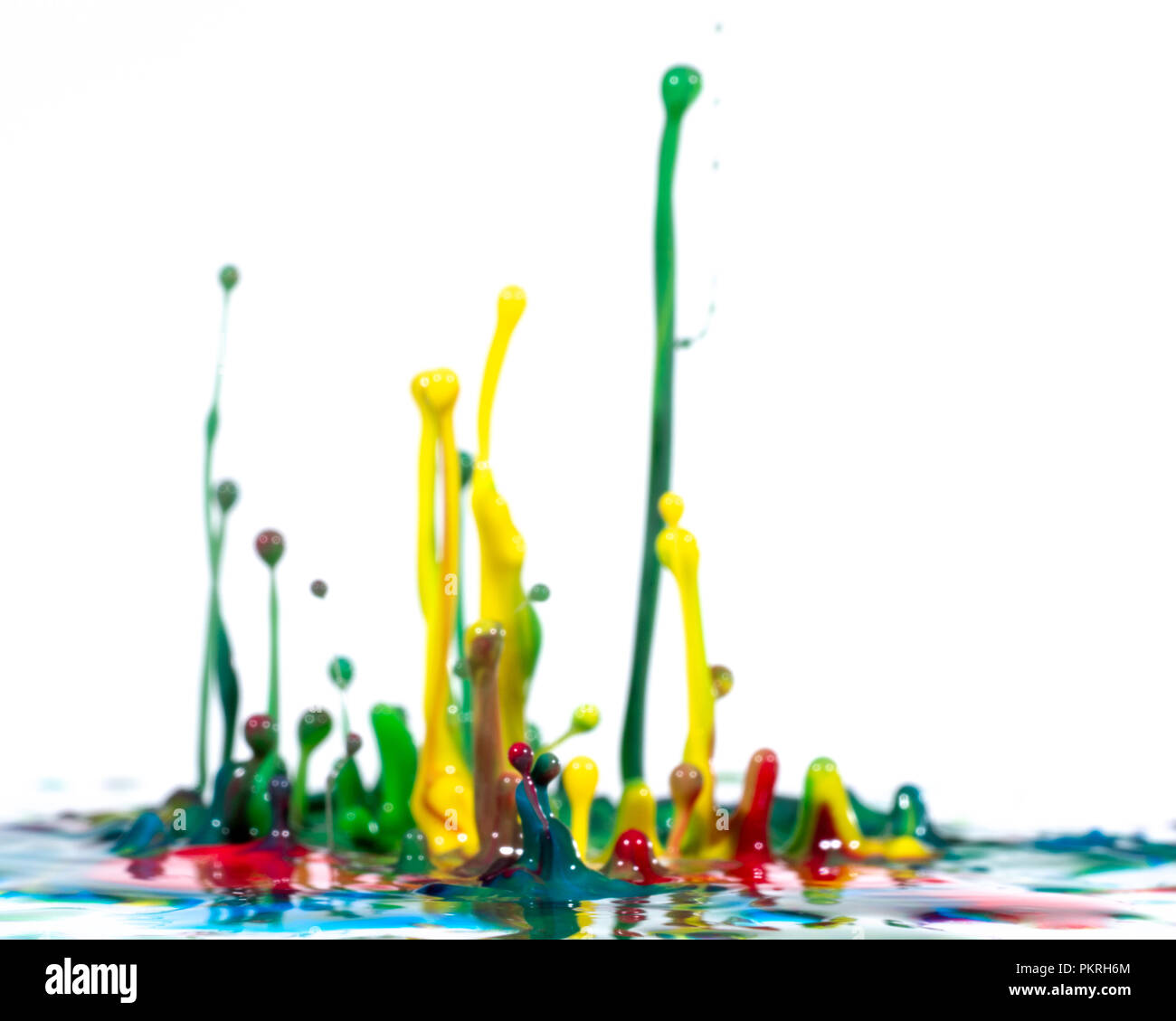 Splash of color ink on white background Stock Photo - Alamy