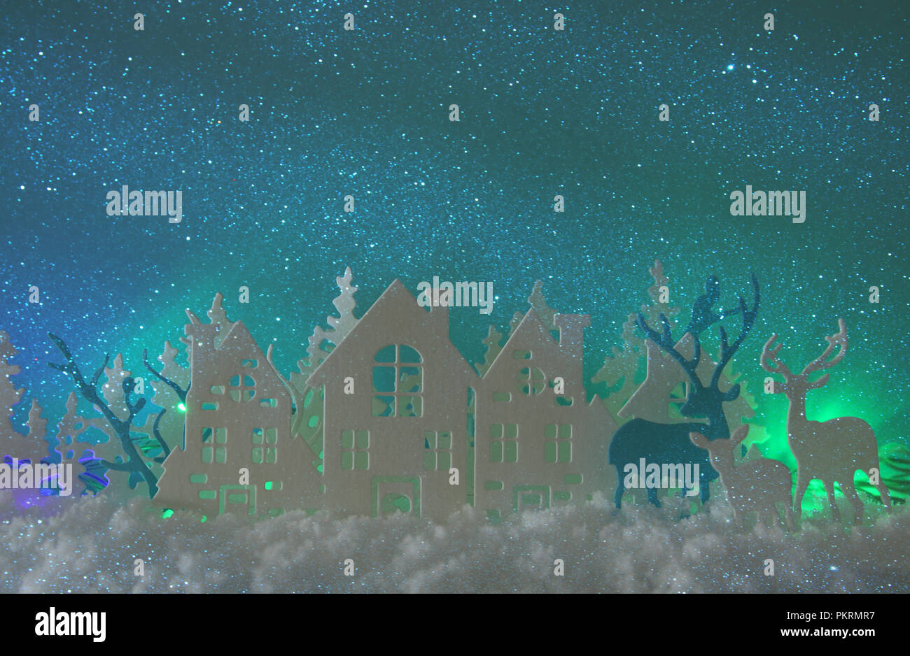 Magical Christmas paper cut winter background landscape with houses ...