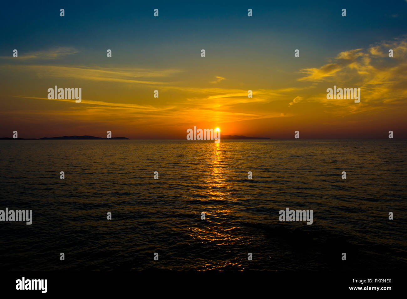 Beautiful sunset at Logas beach at Peroulades village of Corfu island ...