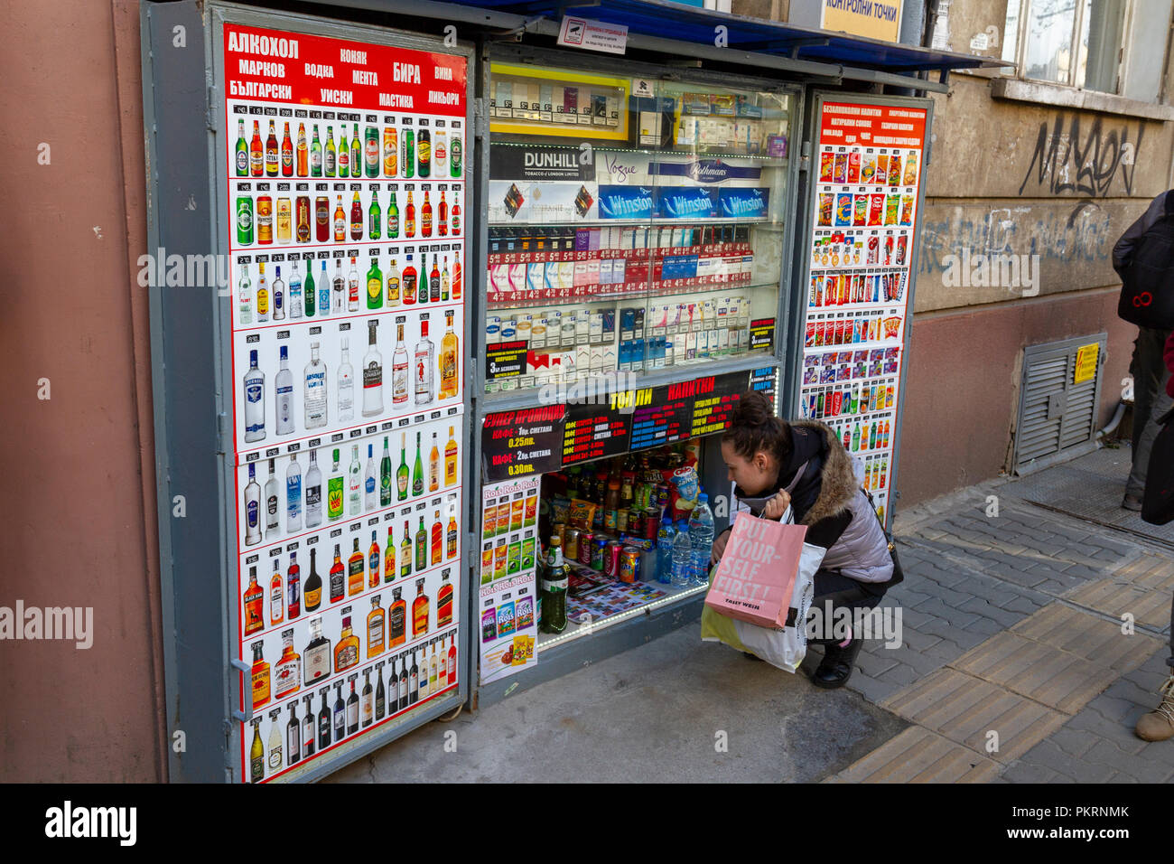 Street level off license/liqueur store and cigarette outlet on a street ...