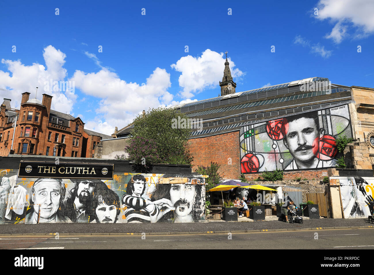 Street murals decorate the walls around the Clutha Bar, reopened in ...