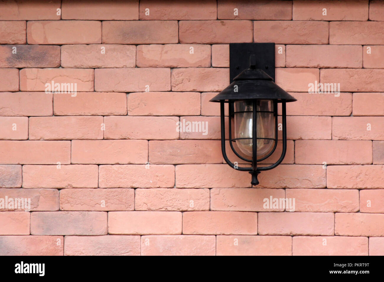 photo of wall lamp on the brick wall Stock Photo - Alamy