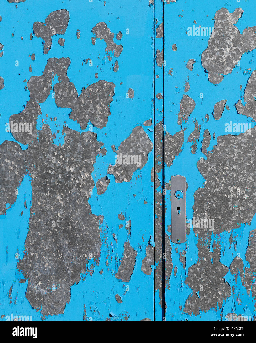 Peeling blue pain on metal door in St Anthony, Newfoundland Stock Photo ...