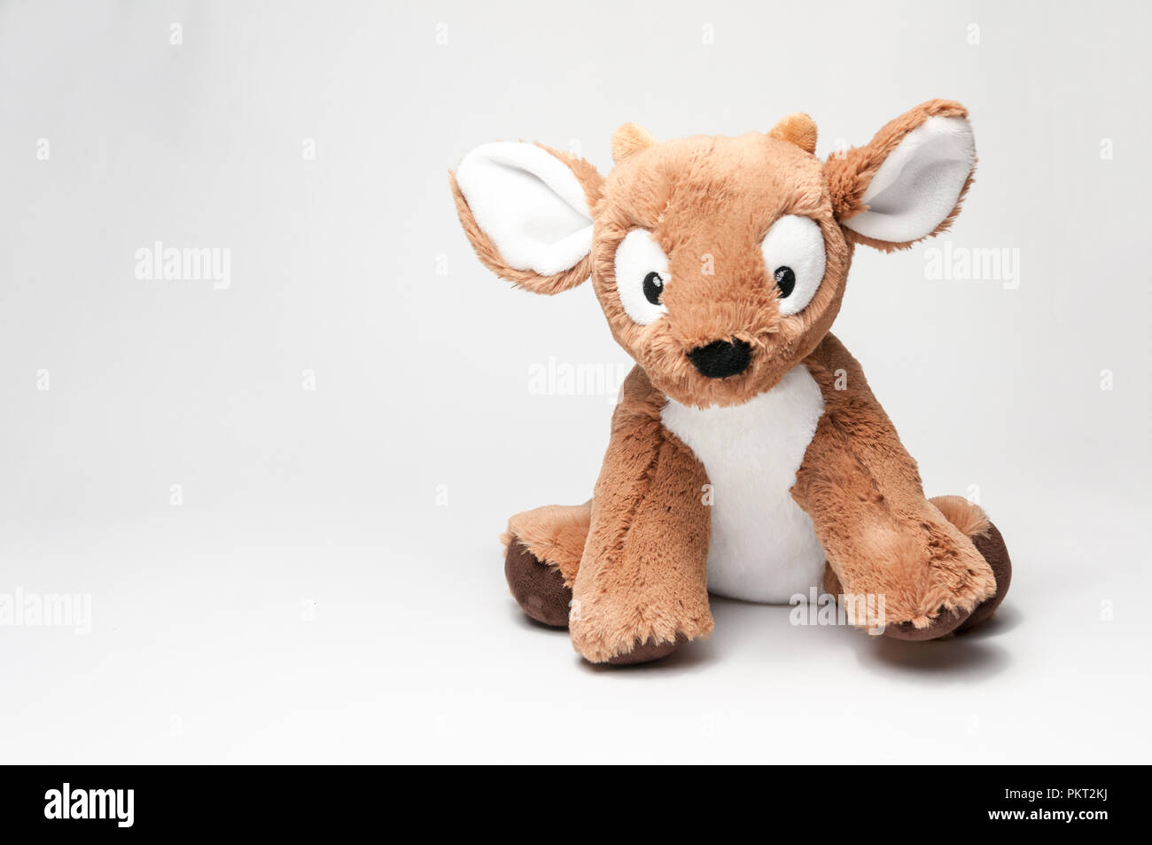 Stuffed toy deer on a isolated white background Stock Photo - Alamy