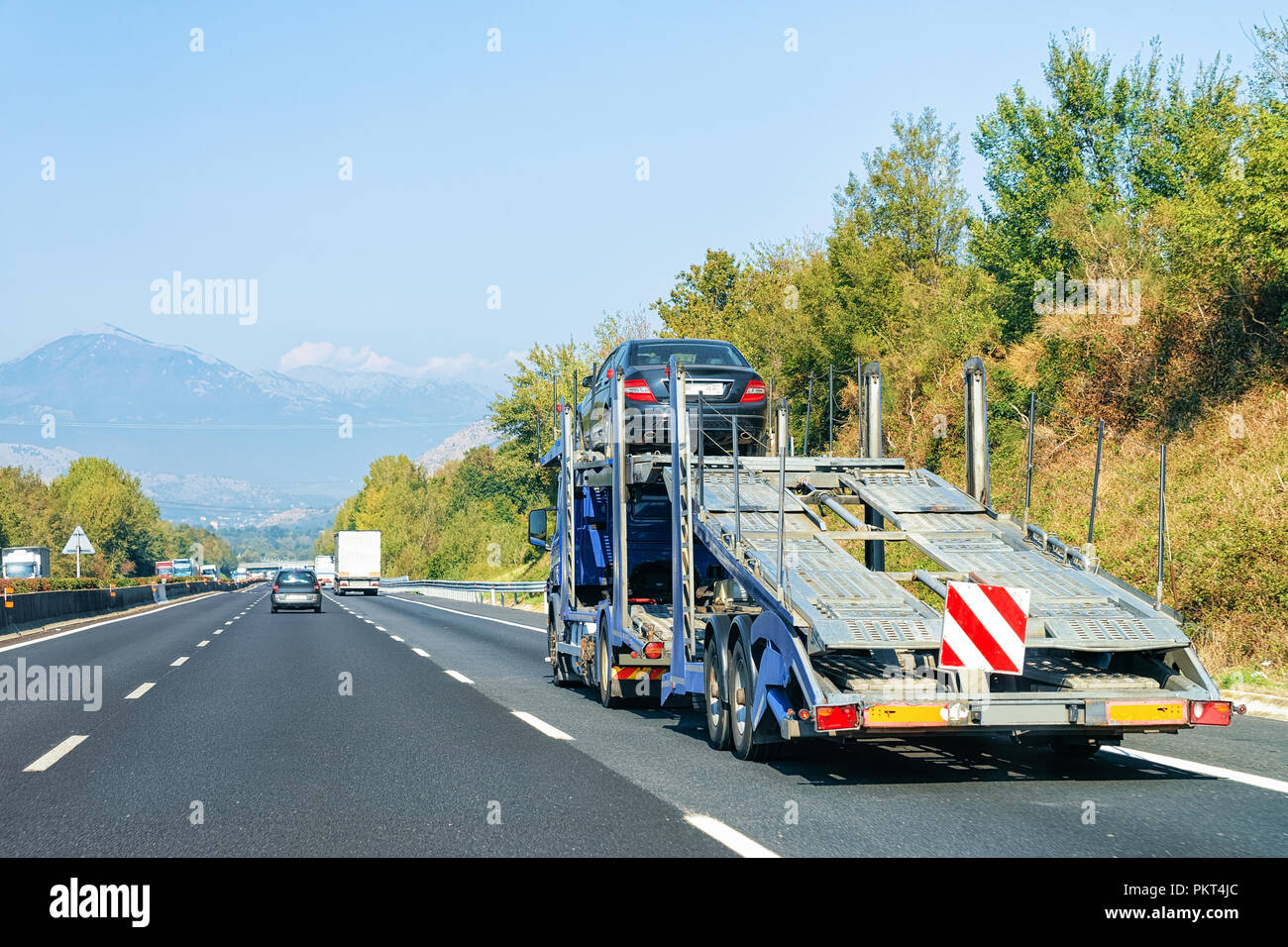 Car carrier truck on the road. Transporter Stock Photo - Alamy