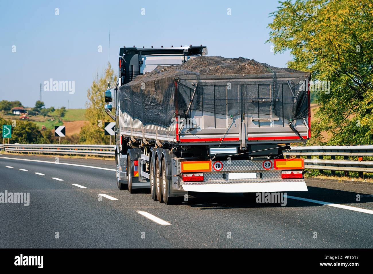 Truck at the road in Italy. Lorry transport delivering some freight ...