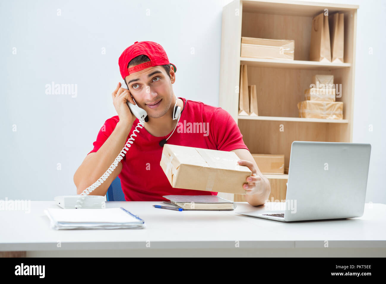 Call center worker at parcel distribution center in post office Stock ...