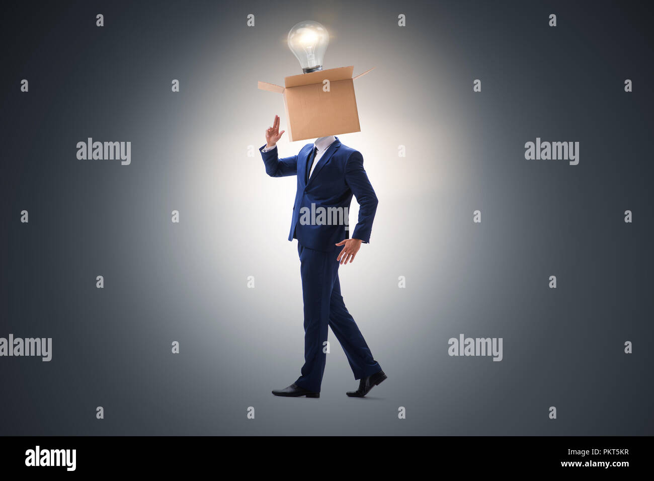 Businessman in thinking out of box concept Stock Photo - Alamy