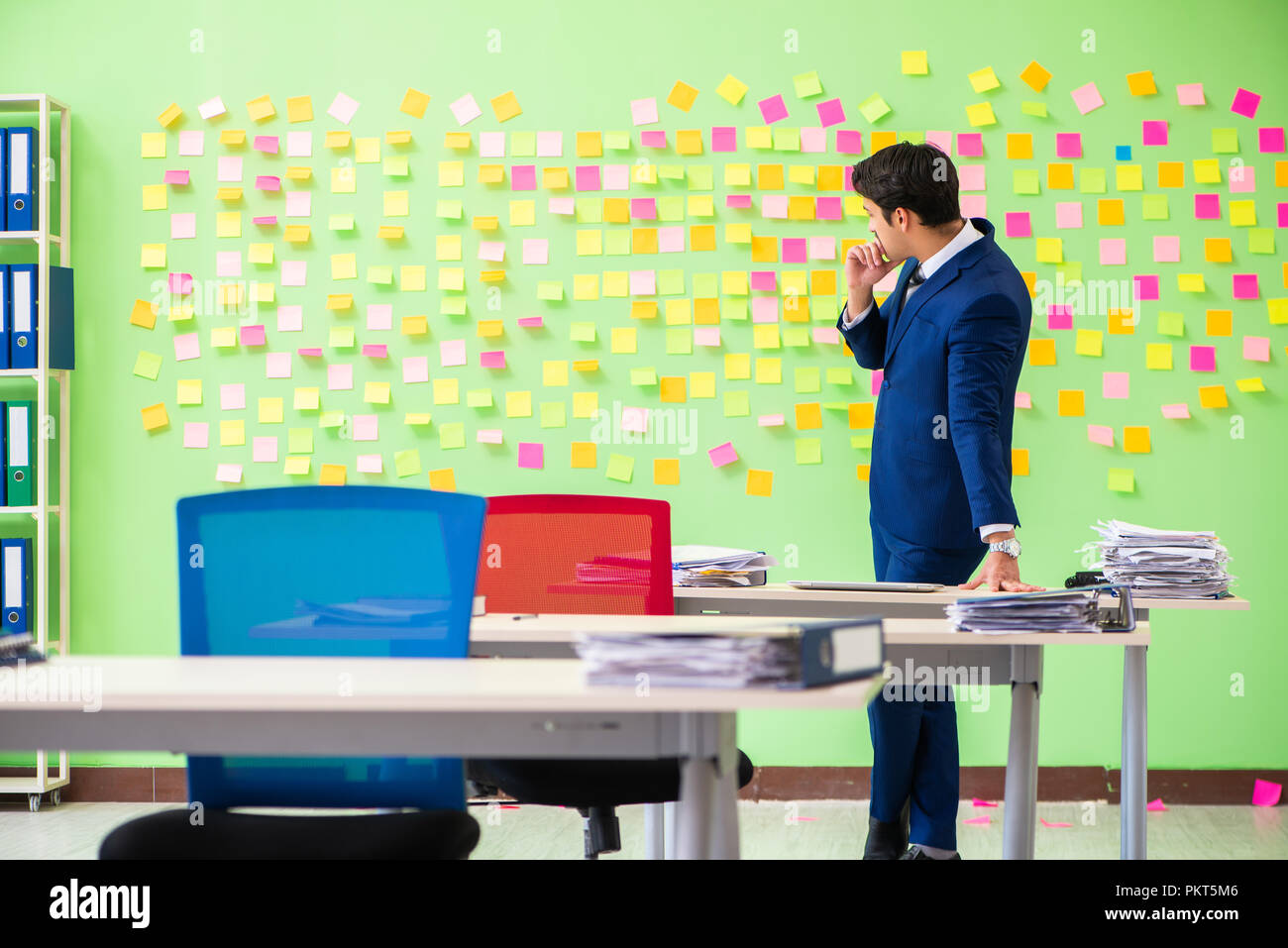 Businessman with many conflicting priorities Stock Photo - Alamy