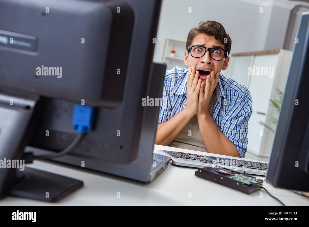 Young trader monitoring markets on screens Stock Photo - Alamy