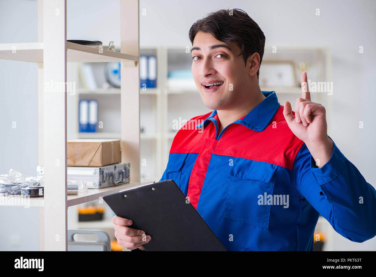 Man working in the postal warehouse Stock Photo - Alamy