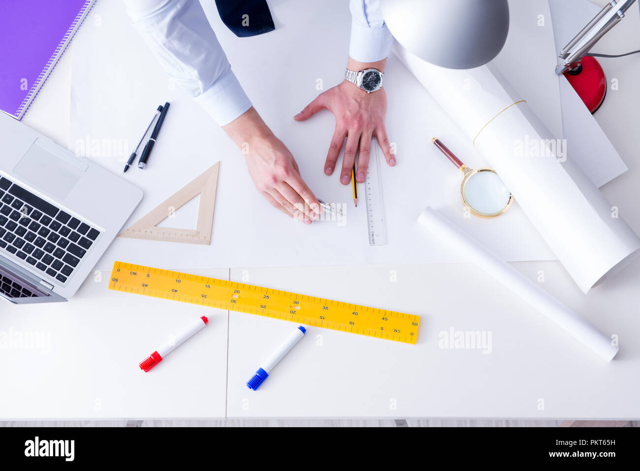 Engineer working on new project drawings Stock Photo - Alamy