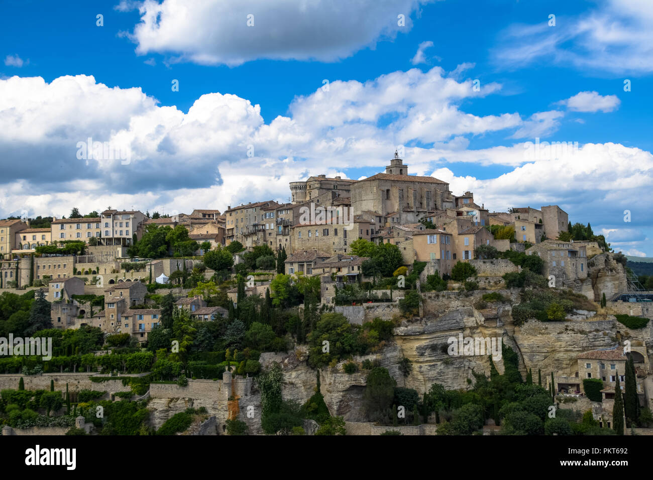 A view of the hilltop medieval village of Gordes in the Luberon area of ...